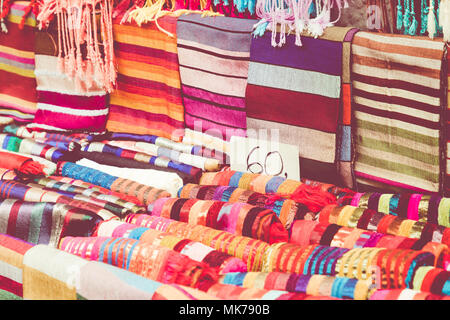 Selection of colorfu clothes on a traditional Moroccan market (souk) in ...