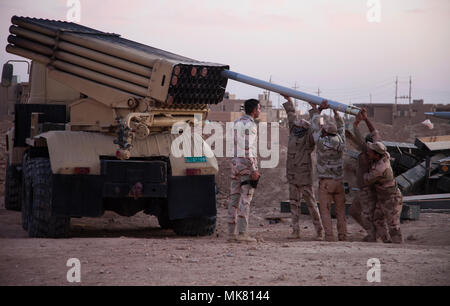 Iraqi security forces load BM-21 Grad near Rawah, Iraq, Nov. 17, 2017 ...