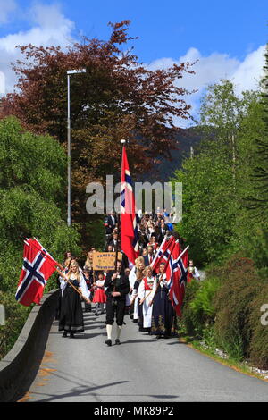 Patriotic Norwegian men and women carry the country flag during a ...