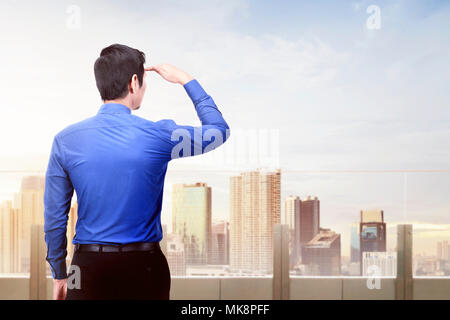 rear view of young successful businessman at business conference room ...