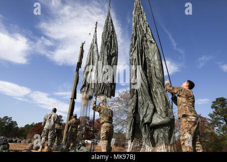 U.S. Army paratroopers conduct a chute-shakeout at during the 20th ...