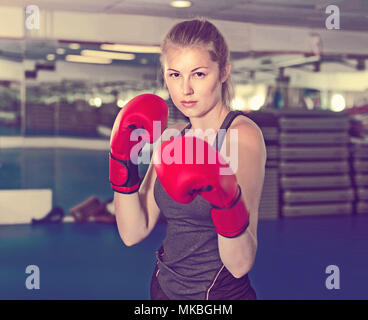 Portrait of positive swiss woman who is training in box gym Stock Photo ...
