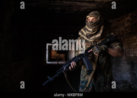 The Arab soldier with the AK-47 Kalashnikov assault rifle Stock Photo ...