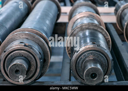 Drive shafts in factory close Stock Photo - Alamy