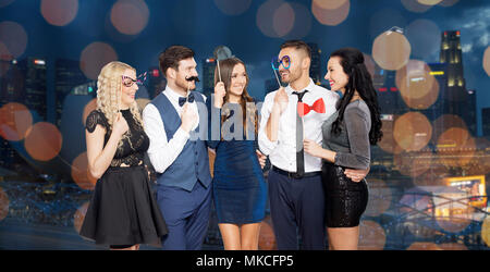 happy couple with party props having fun Stock Photo - Alamy