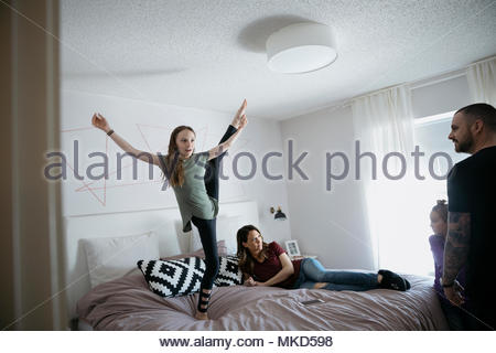 Tween girl relaxing on her bed in her bedroom Stock Photo - Alamy