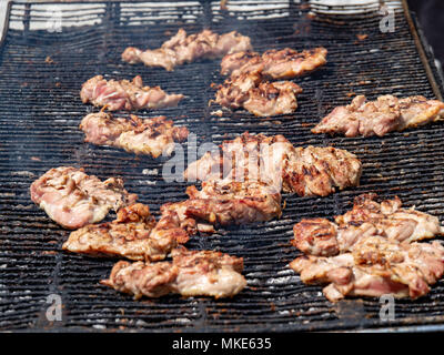 Slabs of meat cooking on barbecue Stock Photo - Alamy