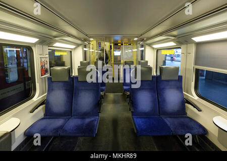 Seating and aisle of an empty railway carriage interior of a Northern ...