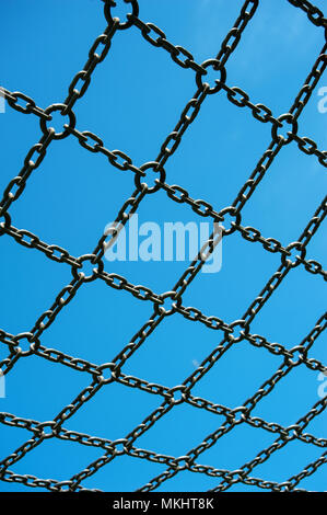 Chains of a soccer goal with blue sky Stock Photo - Alamy