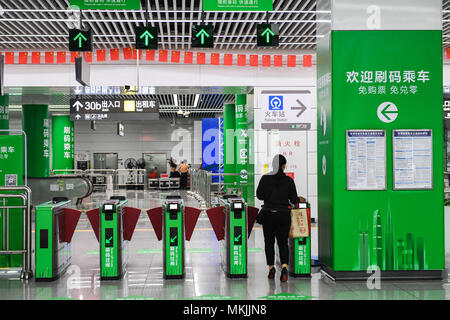 (180508) -- SHENZHEN, May 8, 2018 -- A passenger has a smartphone ...