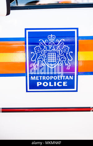 Metropolitan Police sign & coat of arms engraved on stone wall at New ...
