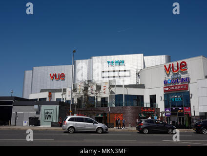Modern buildings with aluminium cladding, vue cinema, trees pavement ...