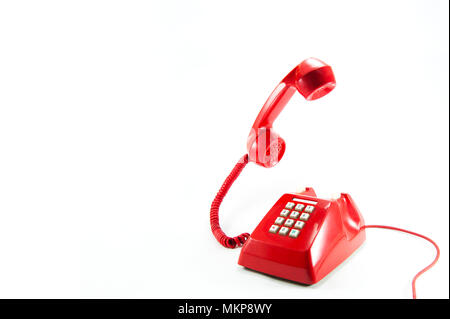 Urgent call waiting , classic red telephone receiver, old telephone on ...
