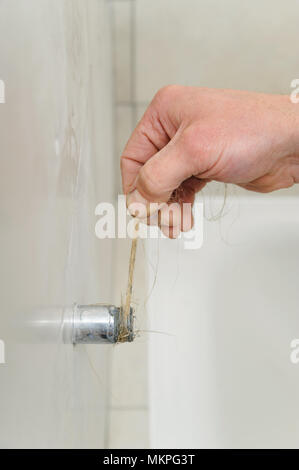 Plumber putting hemp fibers on a thread pipe Stock Photo - Alamy