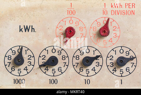 Analogue electricity meter with dials, old electric meter reading in a ...