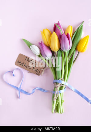 Silk ribbon attached to a bunch of flowers with label Stock Photo - Alamy