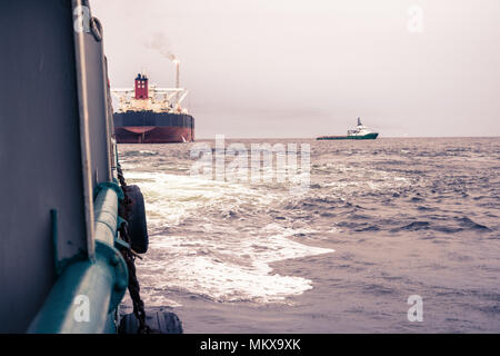 Anchor-handling Tug Supply AHTS vessel during towing .Ocean tug job ...