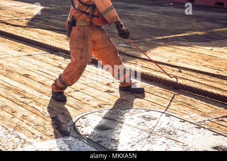 AHTS vessel crew prepare vessel towing wire for static tow tanker ...