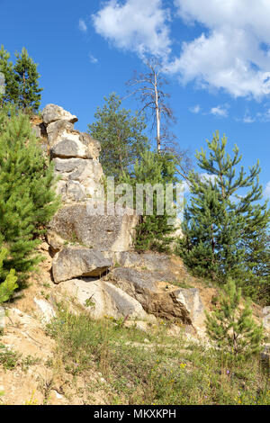 An old sandstone quarry covered with trees Stock Photo - Alamy
