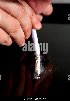 PICTURE POSED BY MODEL. Undated mock-up of a person snorting cocaine. A ...