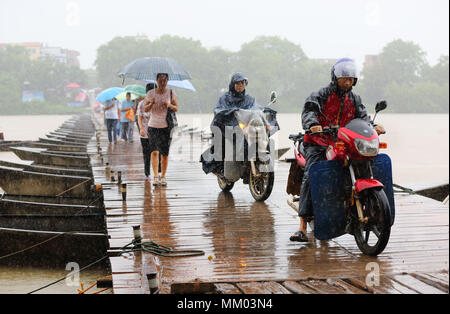 May 9, 2018 - Ganzh, China - Local people walk on the ancient pontoon ...
