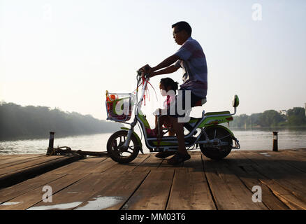 Ganzh, China. 9th May, 2018. Local people walk on the ancient pontoon ...