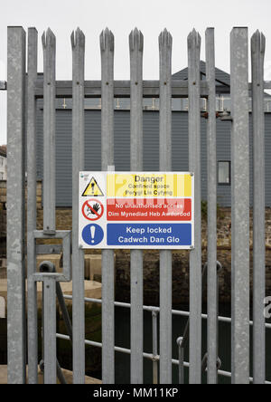 danger confined area risk warning sign sign bilingual welsh and english ...