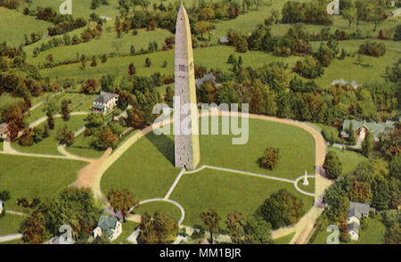 A view of Bennington battle monument Vermont behind a road and colorful ...