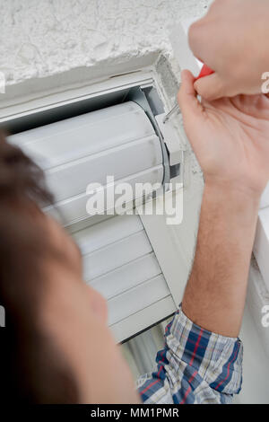 man fitting window Stock Photo - Alamy
