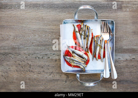 Grilled sardines and tomato on silver metal pan. Greek starter Stock ...