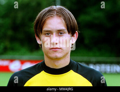 Tomas Rosicky (R) of German Bundesliga club Borussia Dortmund jumps ...