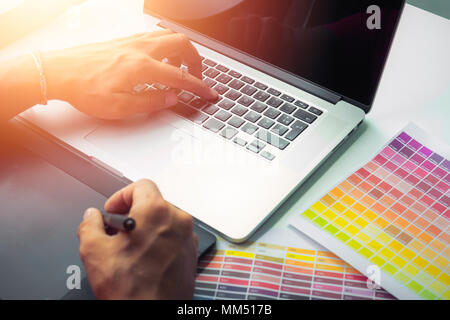 Concept of modern working style. Hand holding smartphone and other one ...