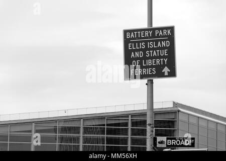 Sign showing the gates for Ellis island and Liberty Island Stock Photo ...
