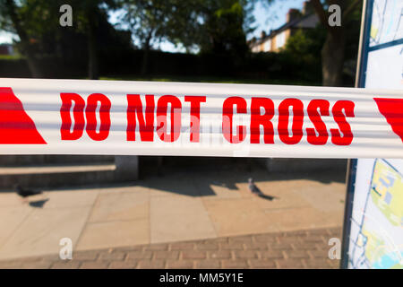 Inner cordon tape barrier placed by police or scene of crime officer ...