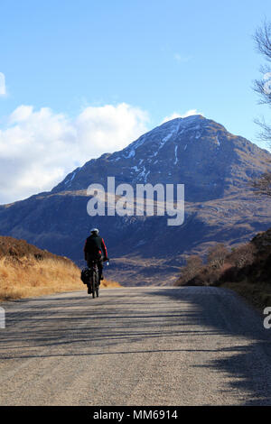 Cycling in Sutherland with Ben Stack in distance Stock Photo - Alamy