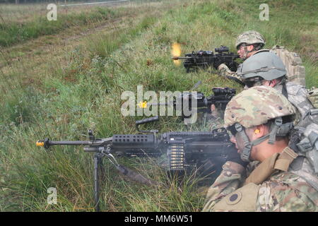 Soldiers take cover behind a berm after making contact with the enemy ...