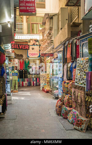 Clothes and textiles for sale in the textile markets of old town Dubai ...