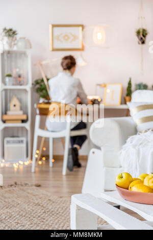 Home working area with office desk set up in living room Stock Photo ...
