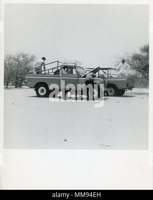 Snapshot of a man working under the hood of a truck Stock Photo - Alamy