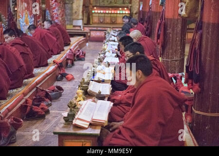Tibetan monks inside the Gonchen Monastery in Dege, Sichuan, China ...