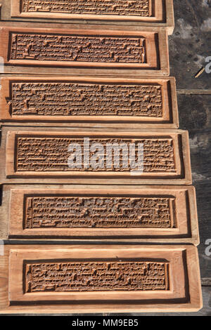 Tibetan woodblock prints at the holy Bakong Scripture Printing Press ...