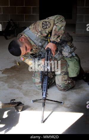 U.S. Army Spc. Justin Farfan assembles a Joint Chemical Agent Detector ...
