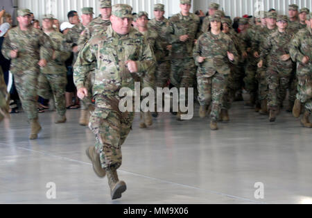 The Soldiers of the 3637th Maintenance Co. storm into the hanger during ...
