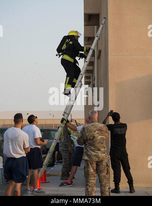 A firefighter with the Qatar Emiri Air Force Fire Department, Al Udeid ...