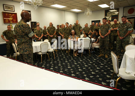 Lieutenant Col. James A. Ryans II (left) congratulates the new ...