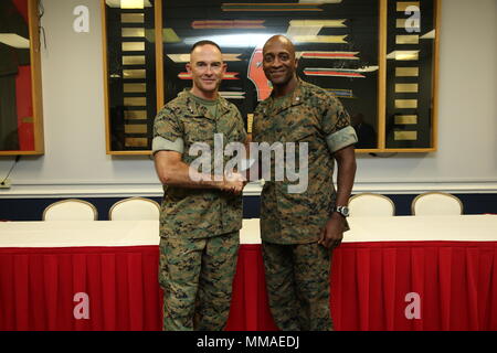 Lieutenant Col. James A. Ryans II (left) congratulates the new ...