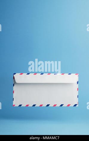 Envelope falling on the ground, blue background Stock Photo - Alamy