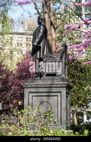 Chester A. Arthur Statue is surrounded by beautiful spring flowering ...