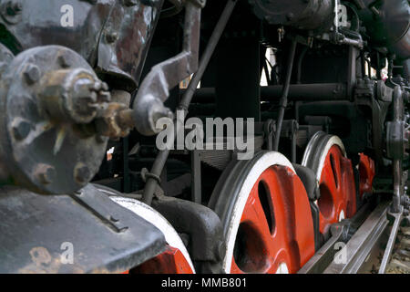 fragment of vintage functioning steam locomotive with leading wheels ...