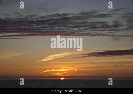 Sunset on the Gulf of Alaska, viewed from a cruise ship sailing west ...